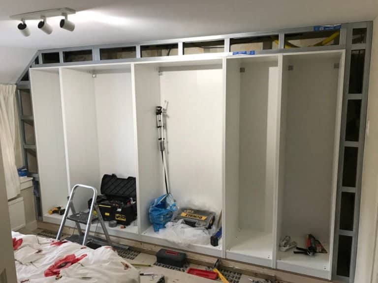 Built-in wardrobe made to fit old closet space